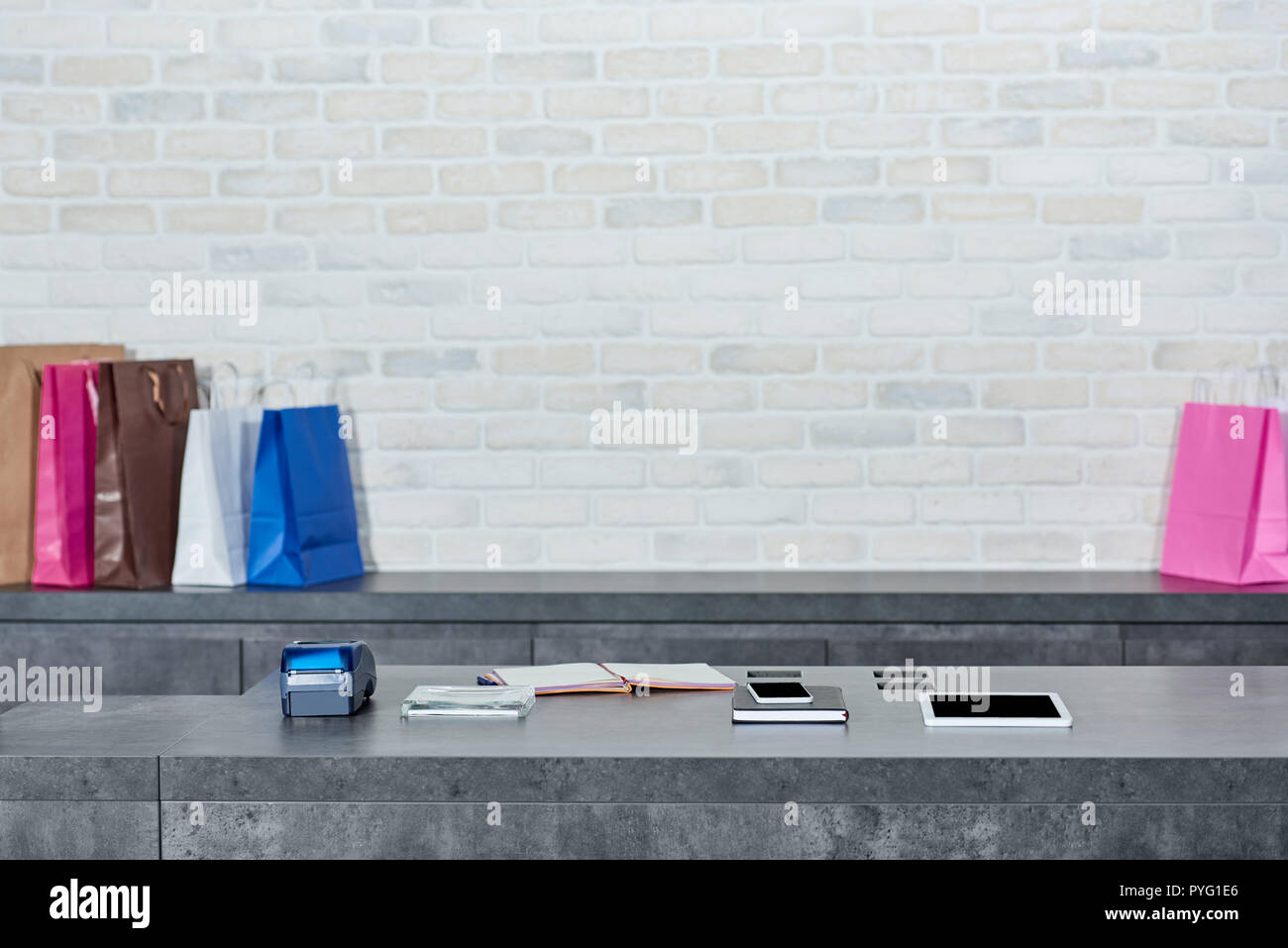 digital devices, payment terminal and shopping bags in store Stock ...