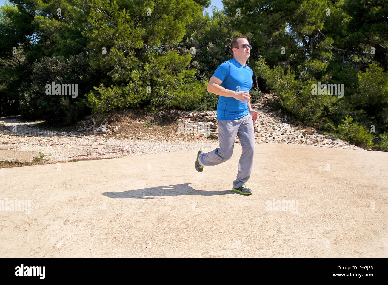 Running man athlete runner training outdoor in forest. Running runner ...