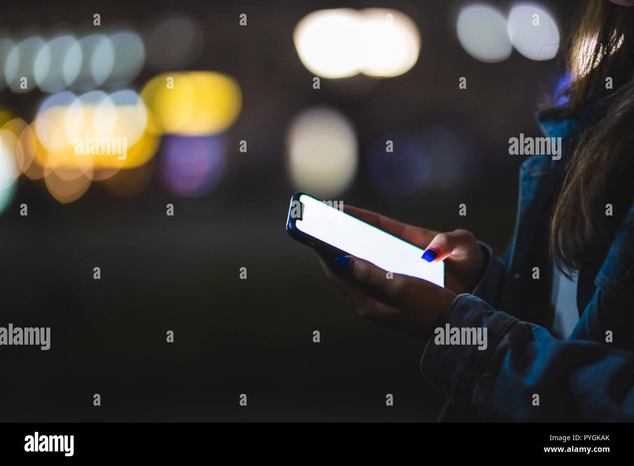 Hand cellphone city night lights hi-res stock photography and images ...