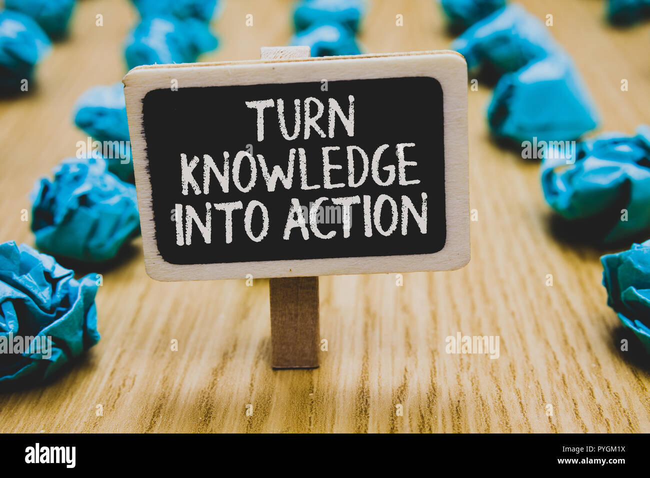 Handwriting text writing Turn Knowledge Into Action. Concept meaning ...