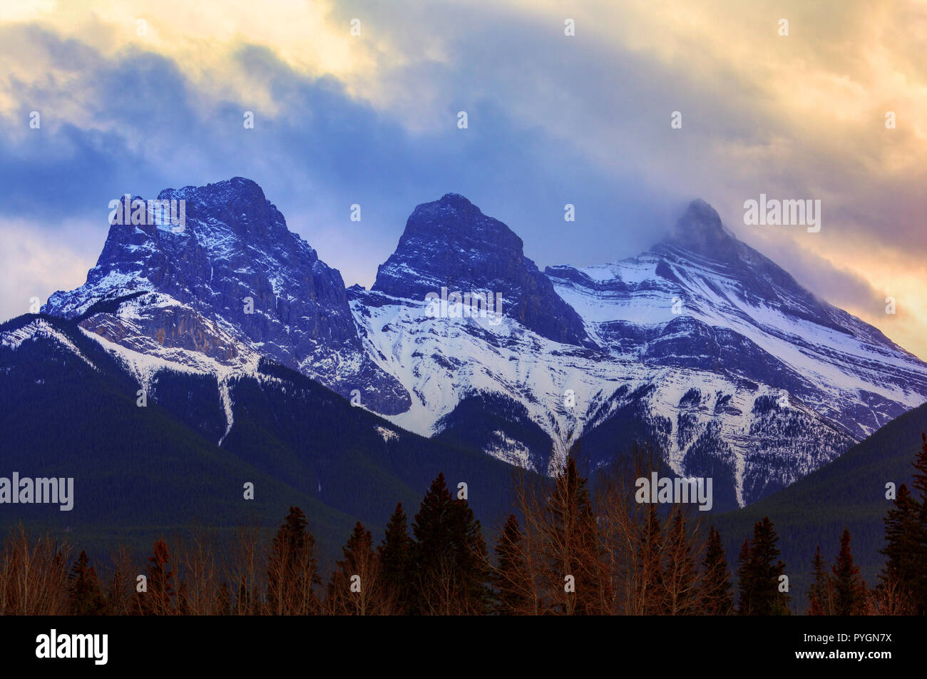 Golden sunset over the famous Three Sisters mountain peaks of Faith ...
