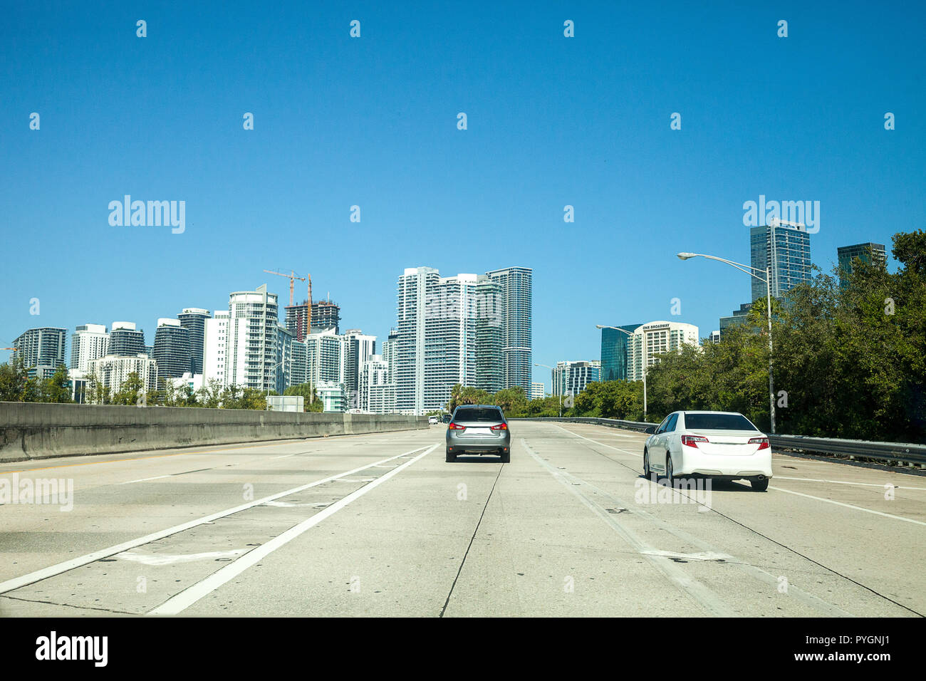 Highway along Skyline of Miami, Florida in the thick of the city with ...