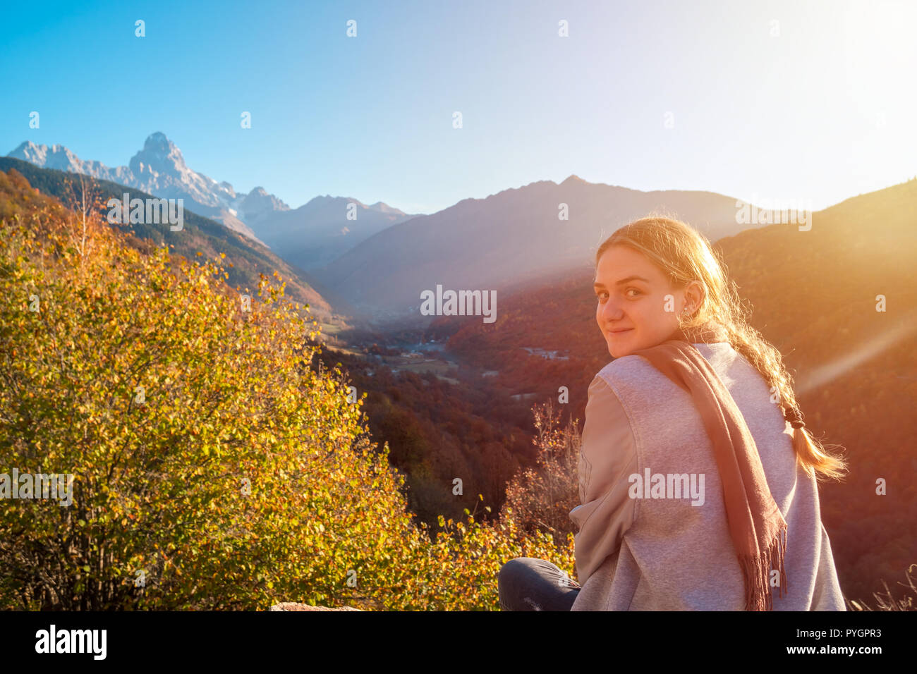 beautiful blonde girl on the background of Mount Ushba, mountains of Svaneti, Georgia Stock ...