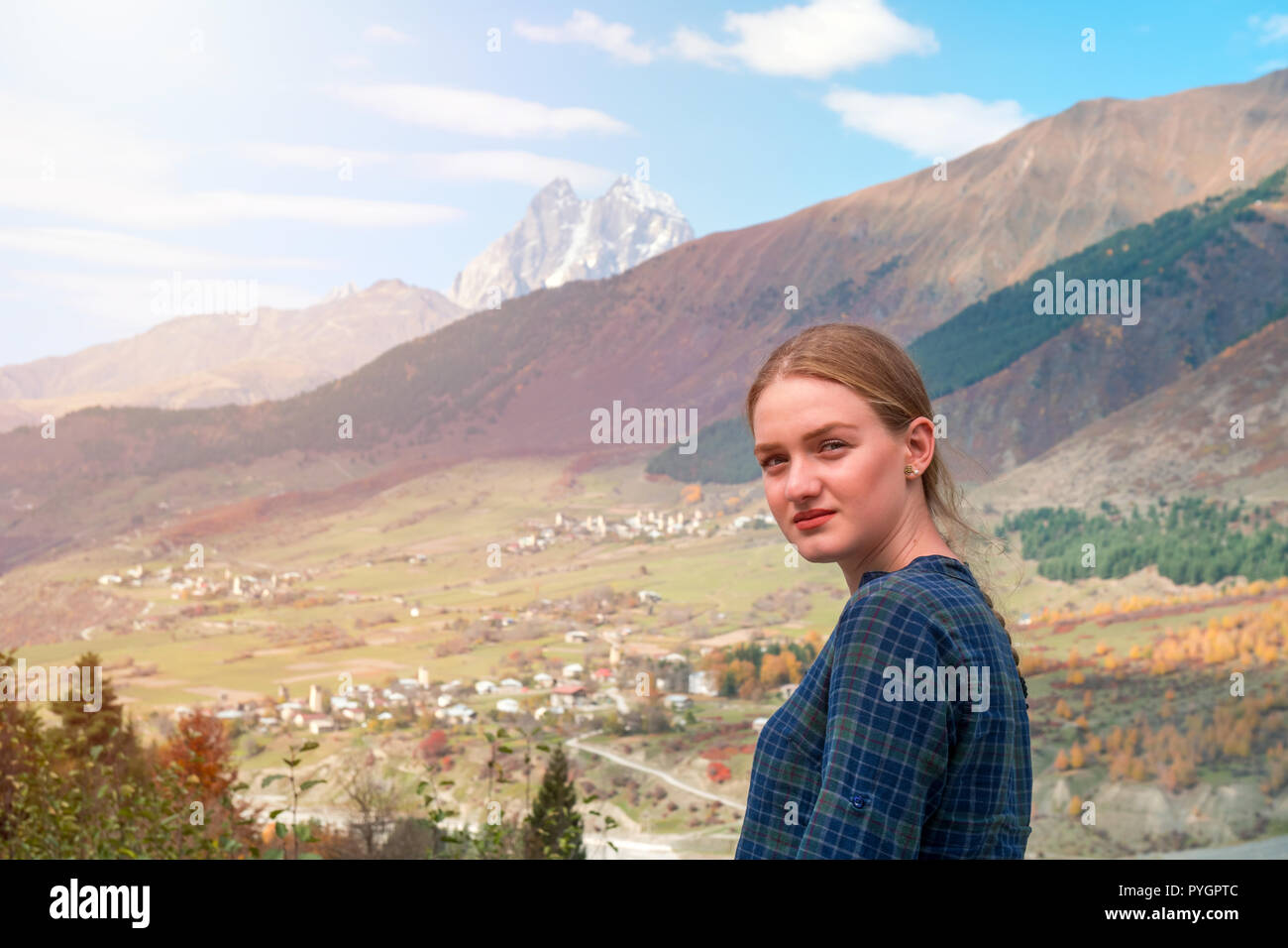 beautiful blonde girl on the background of Mount Ushba, mountains of Svaneti, Georgia Stock ...