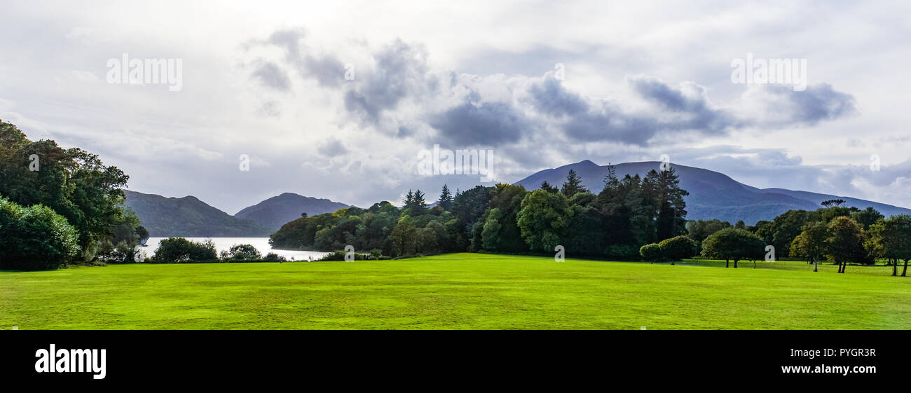 scenic banner view of Lake Killarney on the park grounds near Muckross ...