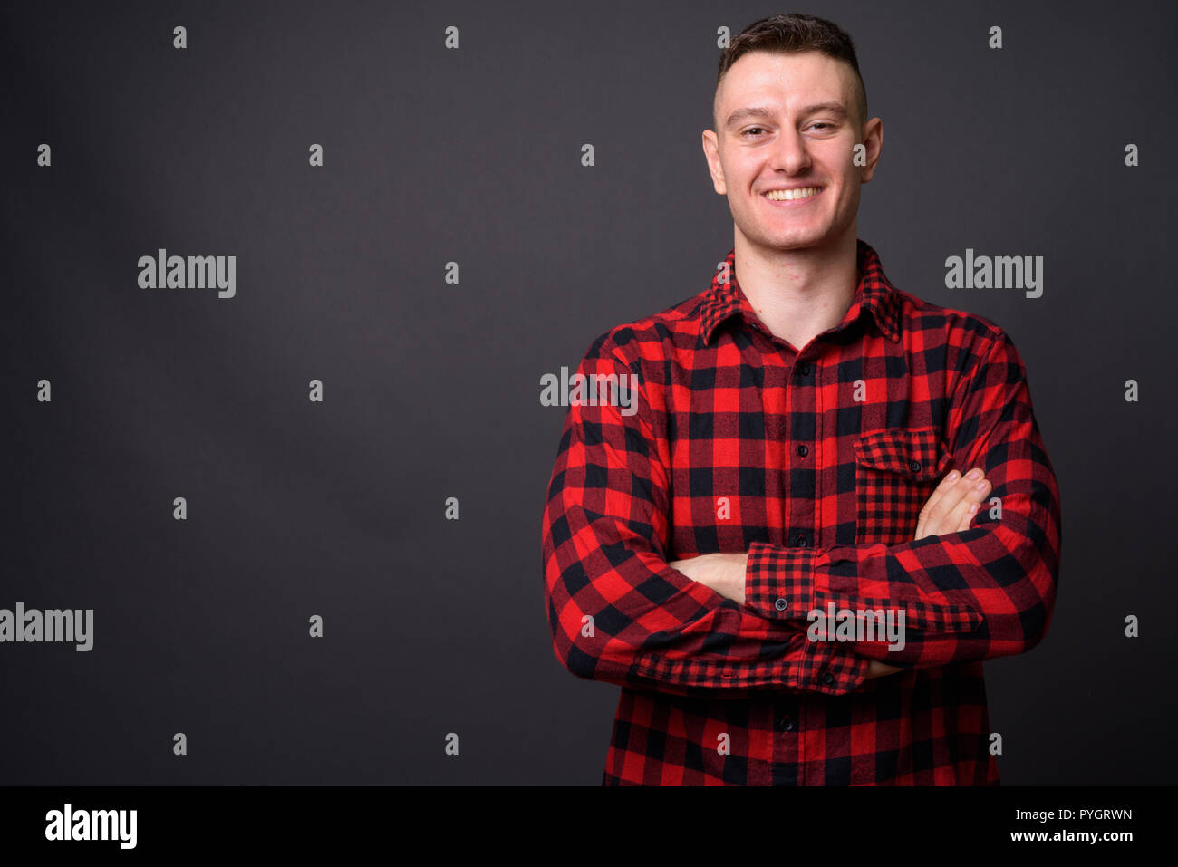 Young handsome happy man hi-res stock photography and images - Alamy