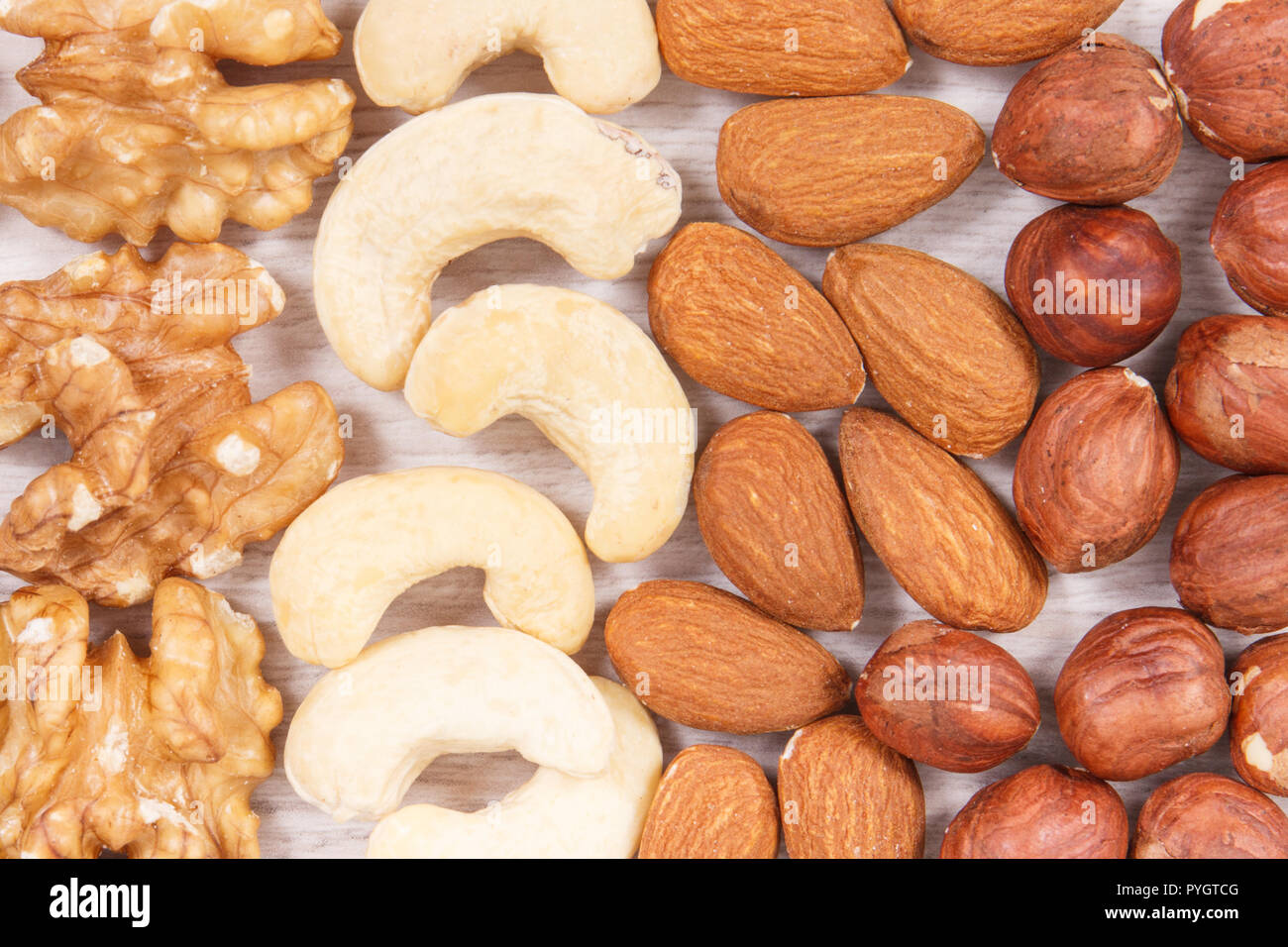Various nuts and almonds containing healthy natural vitamins and ...