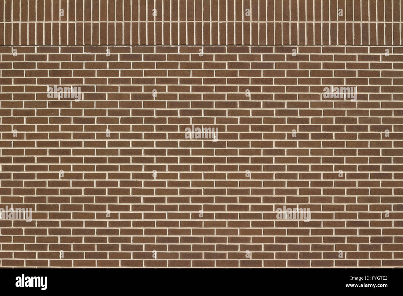 Reddish brown brick wall background with traditional running bond ...