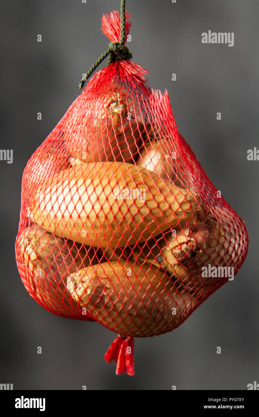 bag of shallots hanging Stock Photo - Alamy