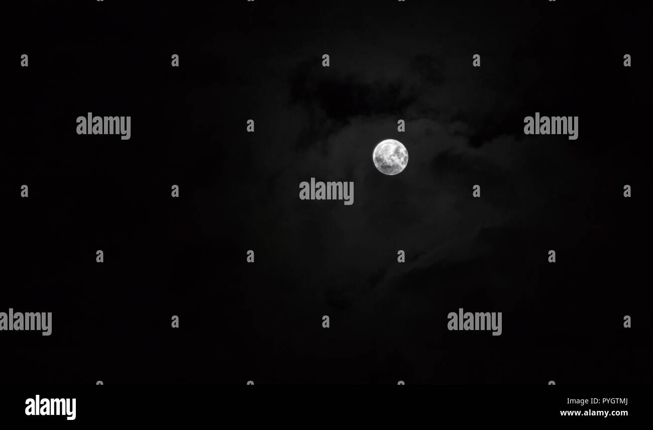 Moon covered in clouds hi-res stock photography and images - Alamy