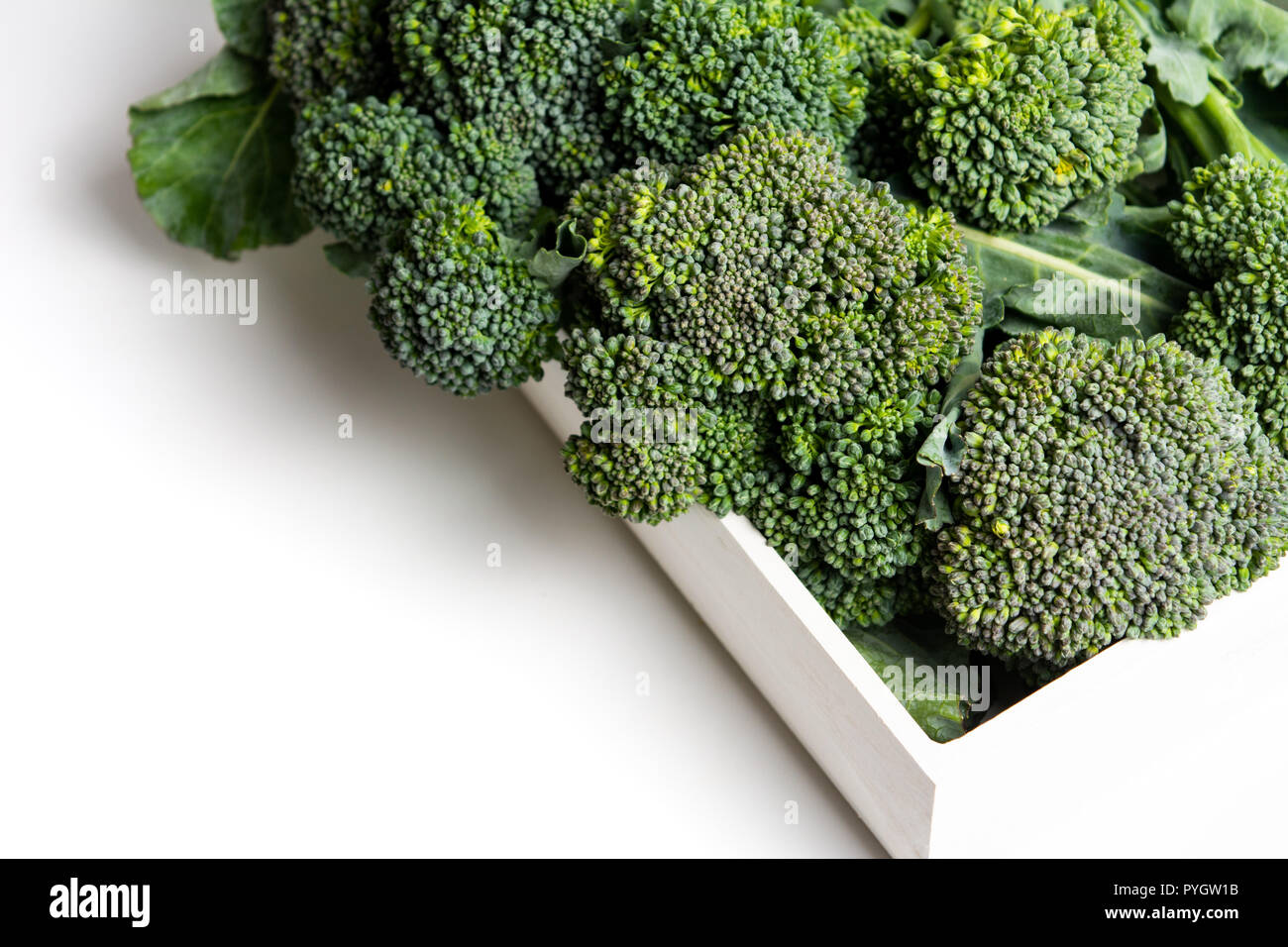 Broccoli in a box on white background top view Stock Photo - Alamy