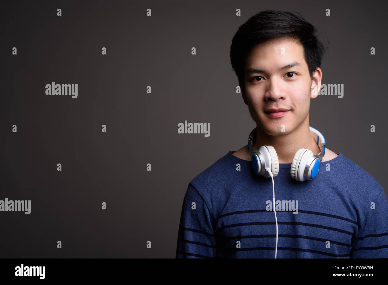 Portrait man wearing purple sweater hi-res stock photography and images ...