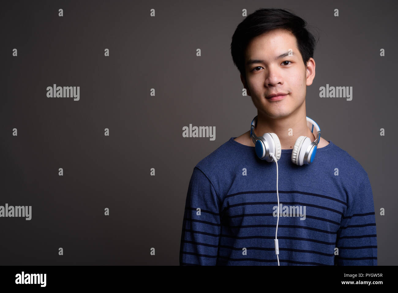 Portrait man wearing purple sweater hi-res stock photography and images ...