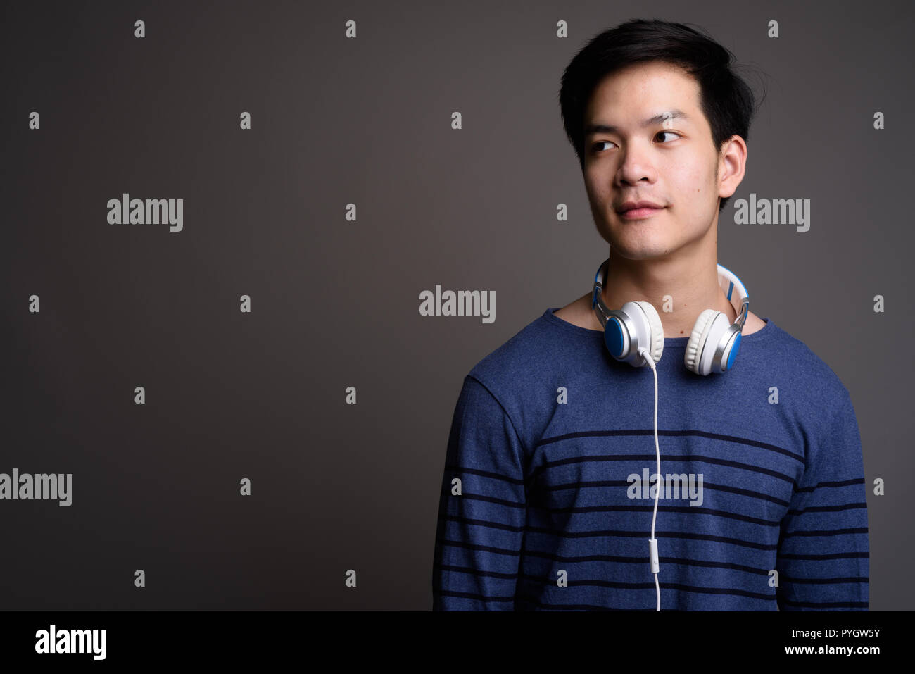 Portrait man wearing purple sweater hi-res stock photography and images ...