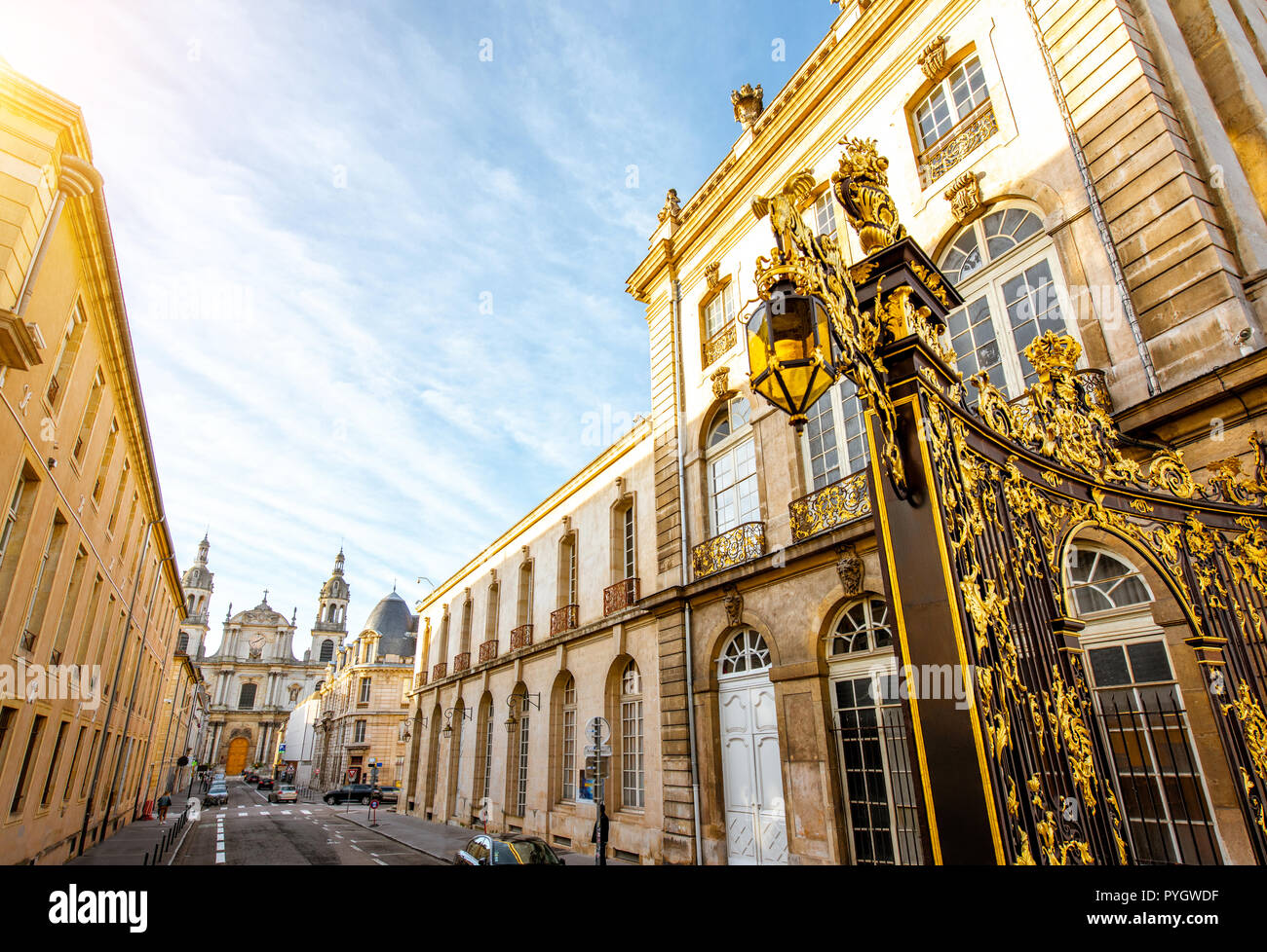 Street view with Notre-Dame cathedral during the morning light in Nancy ...