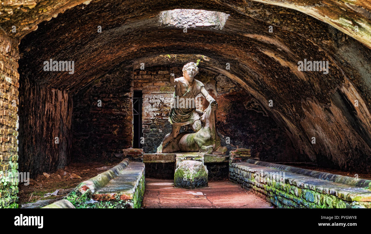 Statue of the god Mithras killing a bull in the thermal s mithraeum in ...