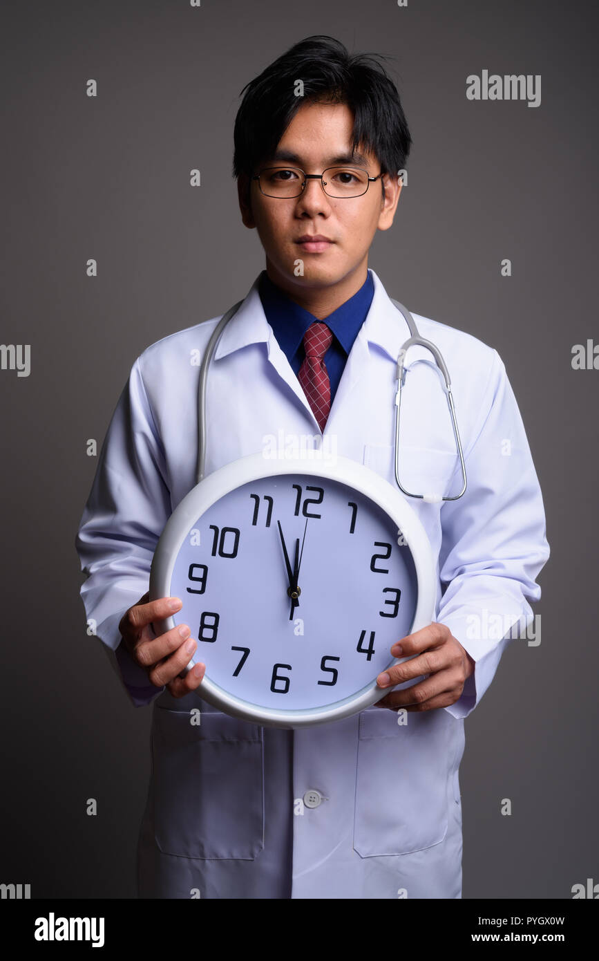 Man with clock hi-res stock photography and images - Alamy