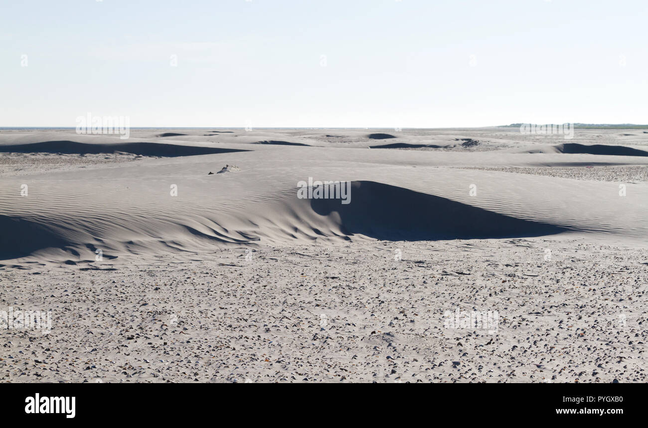 Beach in the middle of the day, shadows forming Stock Photo - Alamy