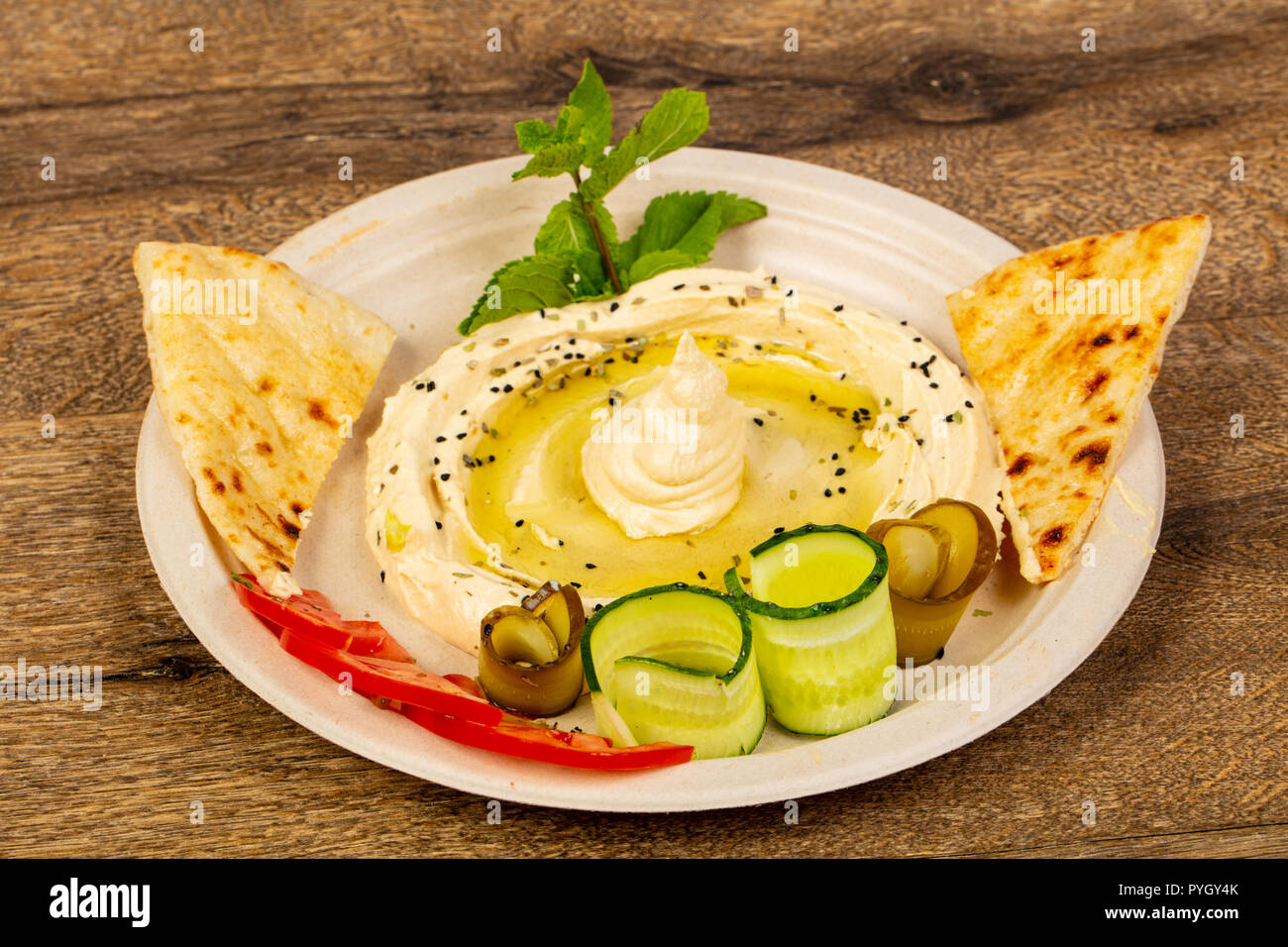 Traditional humus with oil and pita bread Stock Photo - Alamy