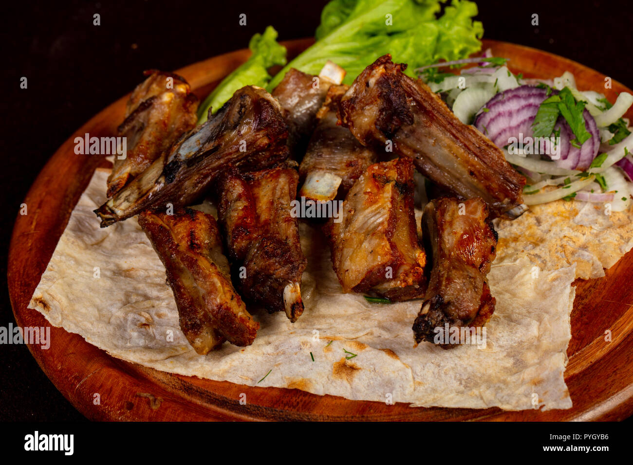 Grilled Mutton ribs with onion Stock Photo - Alamy