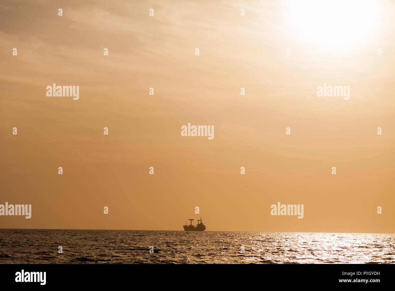 Sunset landscape ocean sea and ship on the horizon Stock Photo - Alamy