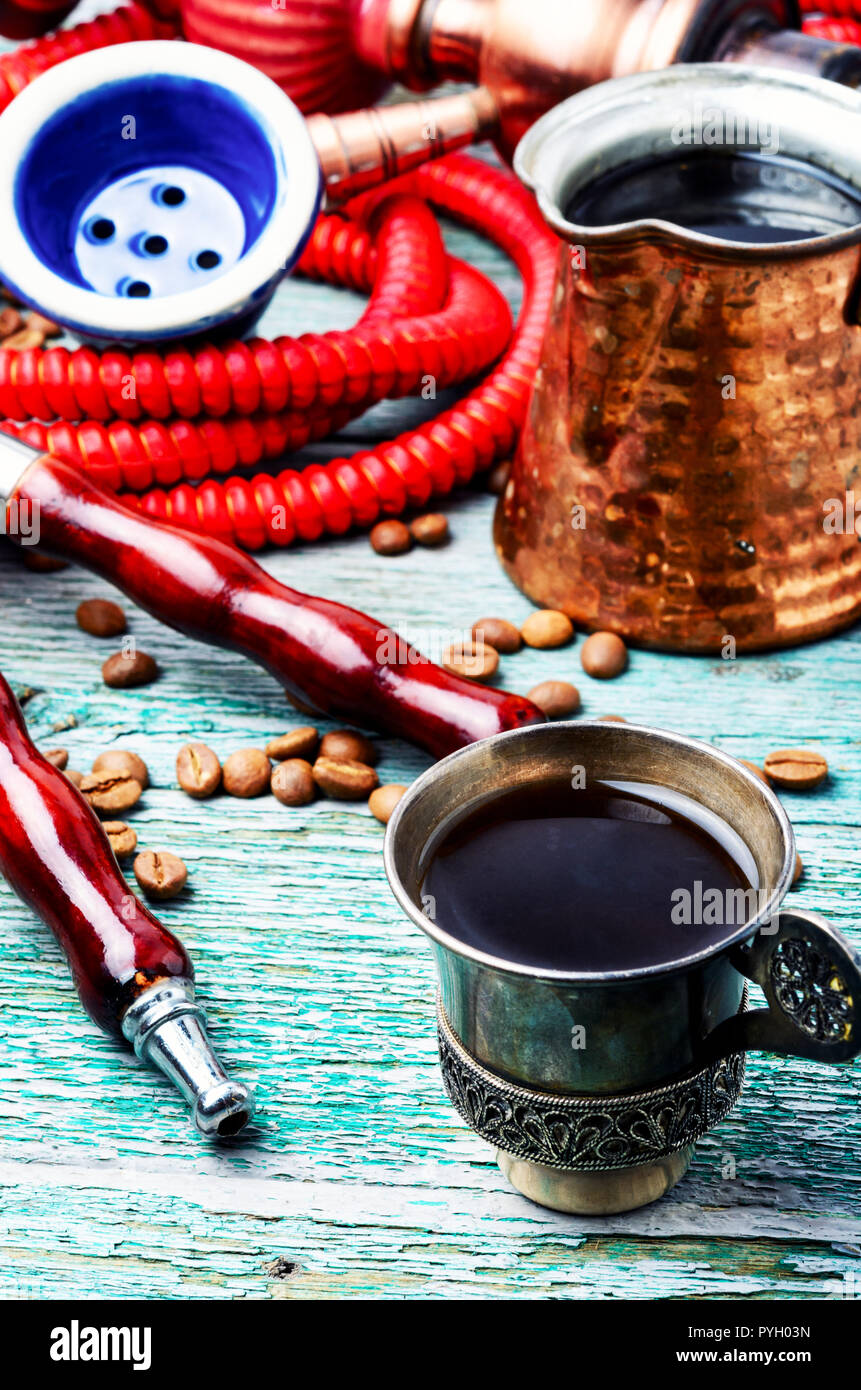 Stylish Turkish hookah for two mouthpieces and a cup of coffee.Arabian ...