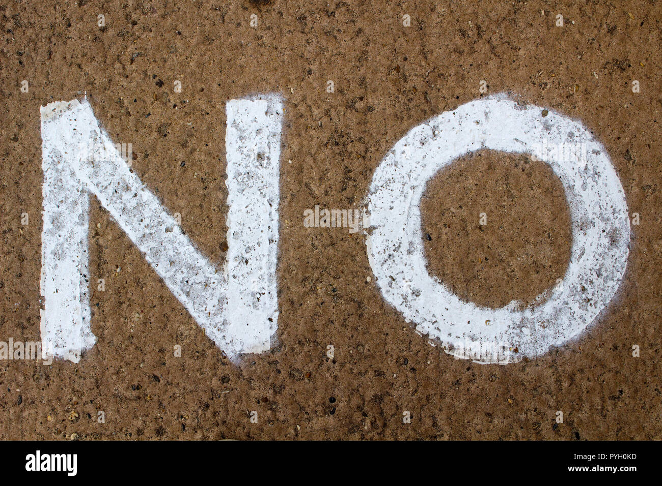 Closeup image showing No painted in white paint on cement Stock Photo ...
