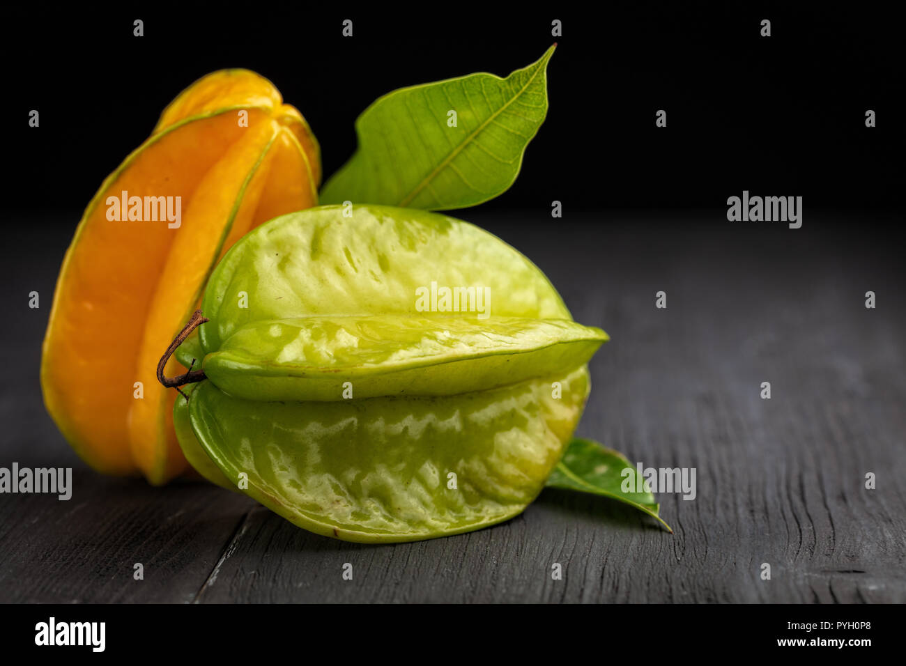 Ripe yellow and green star fruit carambola or star apple ( starfruit ...
