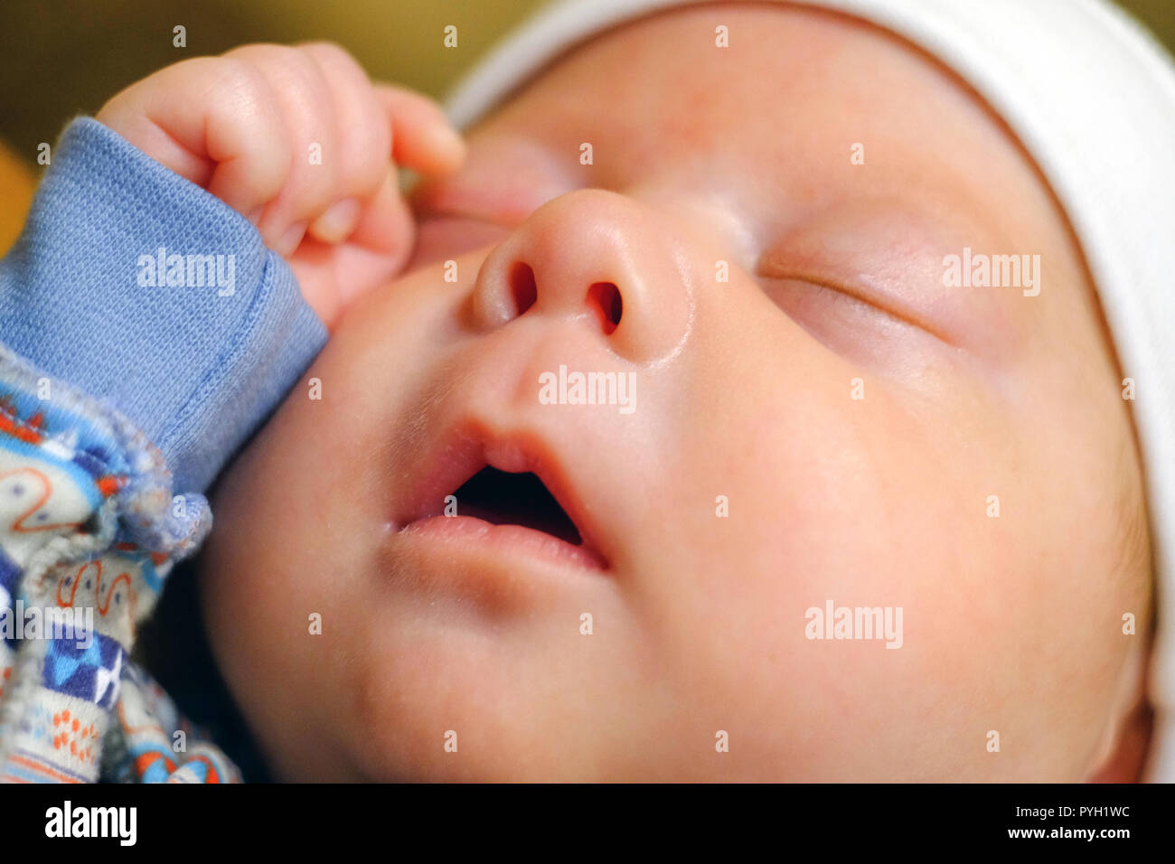 The child raised his hand to his face. Quietly dozing Stock Photo - Alamy