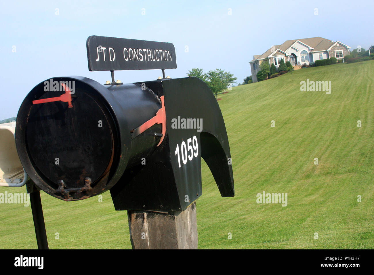 Original mailbox shaped like a hammer Stock Photo - Alamy