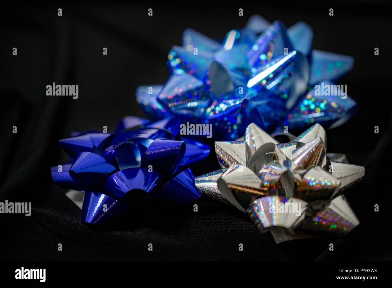 Several Christmas Holiday Satin Bow Ribbons on Back Background. Ribbon ...