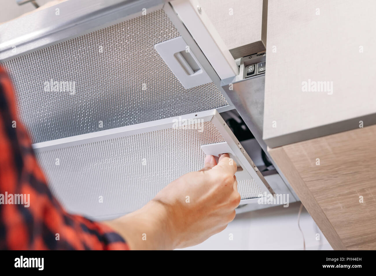 Cooker hood installation hi-res stock photography and images - Alamy