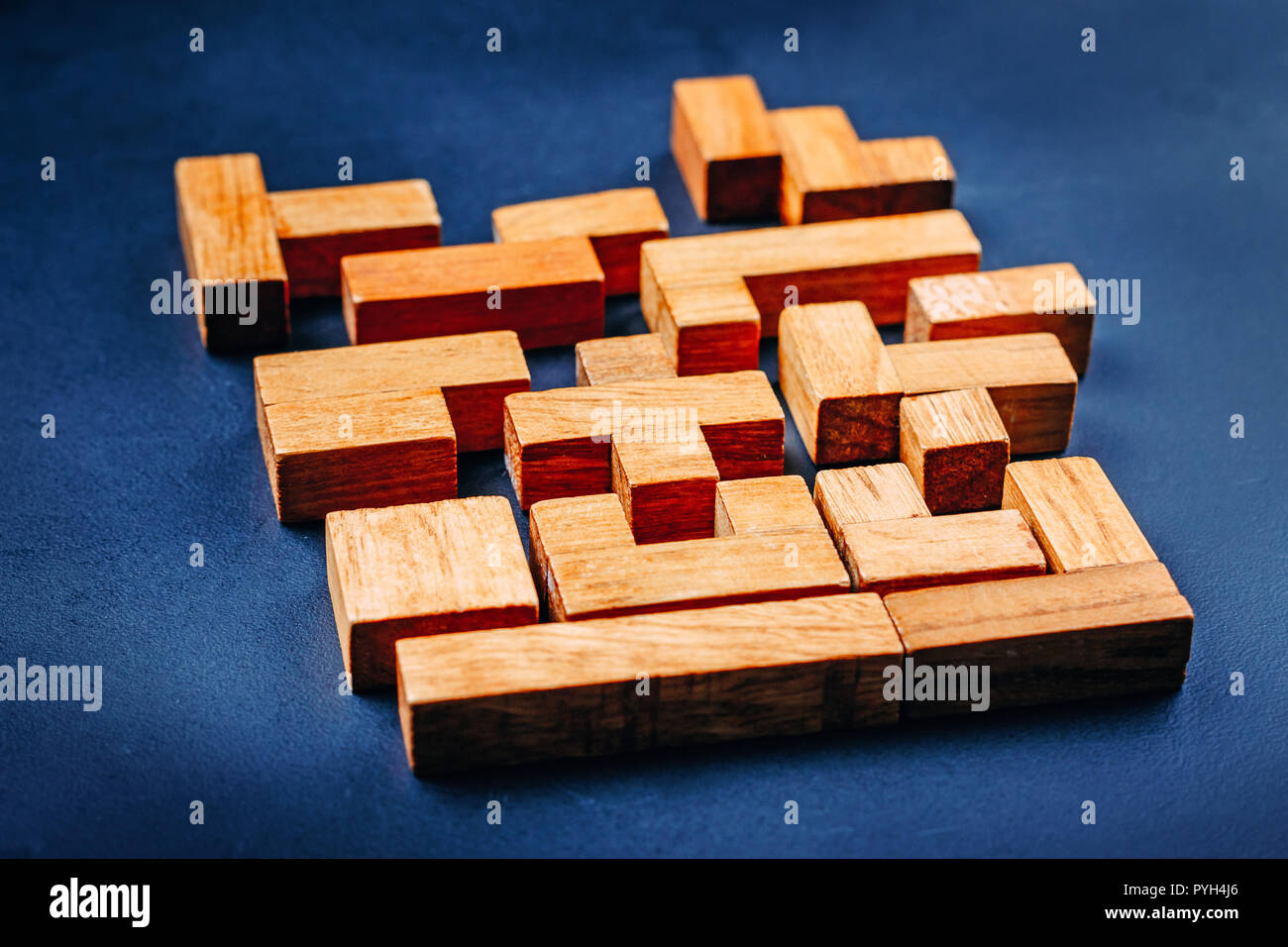 Different geometric shapes wooden blocks on dark background. Creative ...