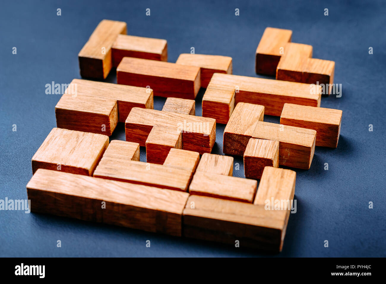 Different geometric shapes wooden blocks on dark background. Creative ...