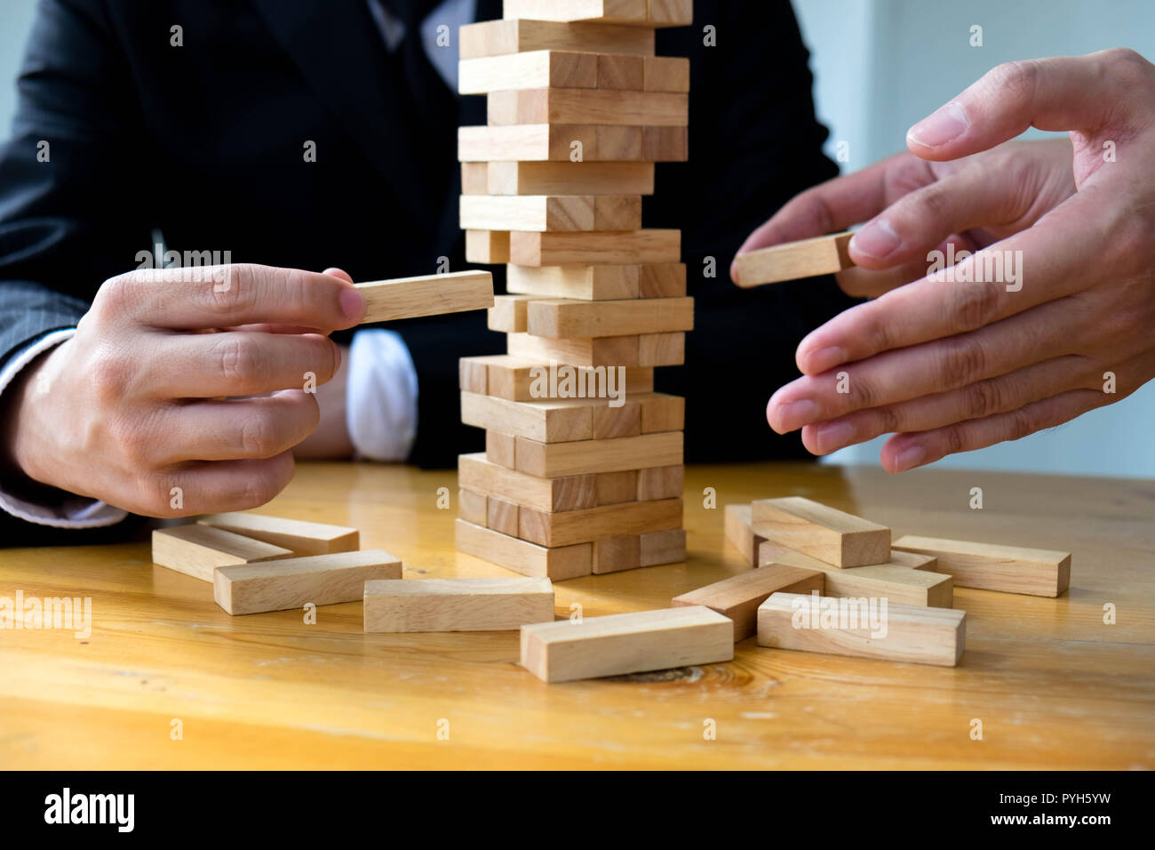 Businessmen picking domino blocks to fill the missing dominos and ...