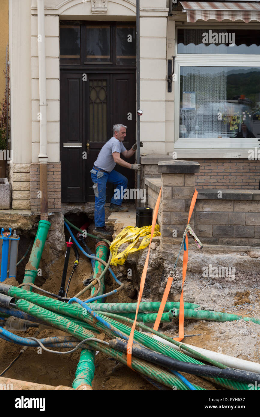 Schengen, Luxembourg - canal works in front of a cafe in the centre of ...