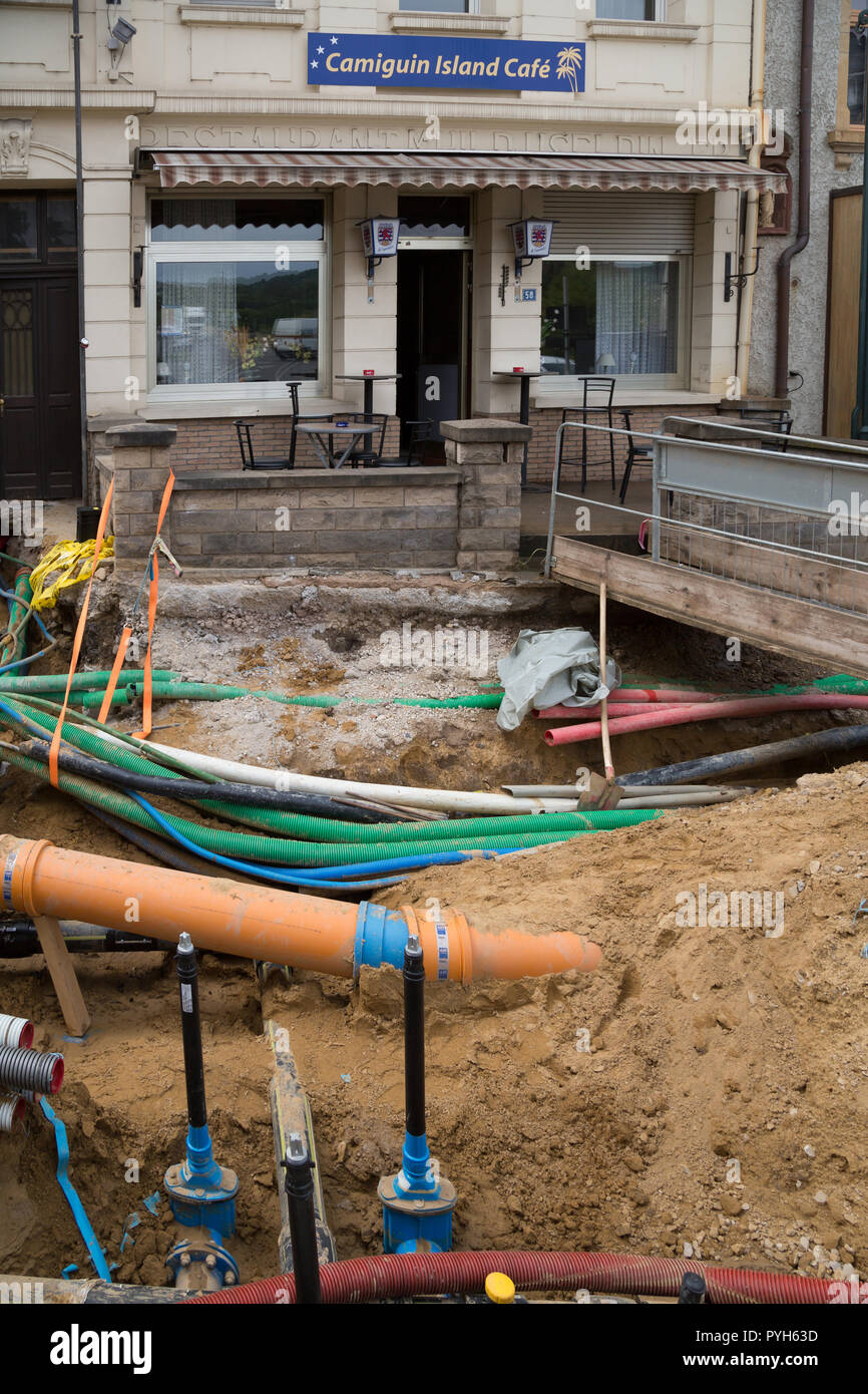 Schengen, Luxembourg - canal works in front of a cafe in the centre of ...