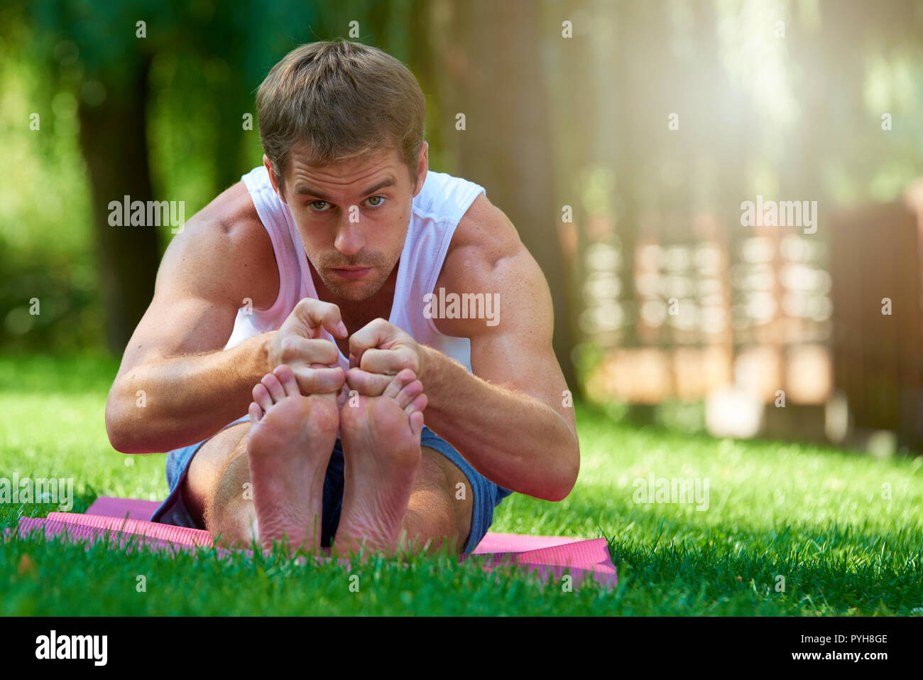Full length shot of man doing yoga outdoor Stock Photo - Alamy