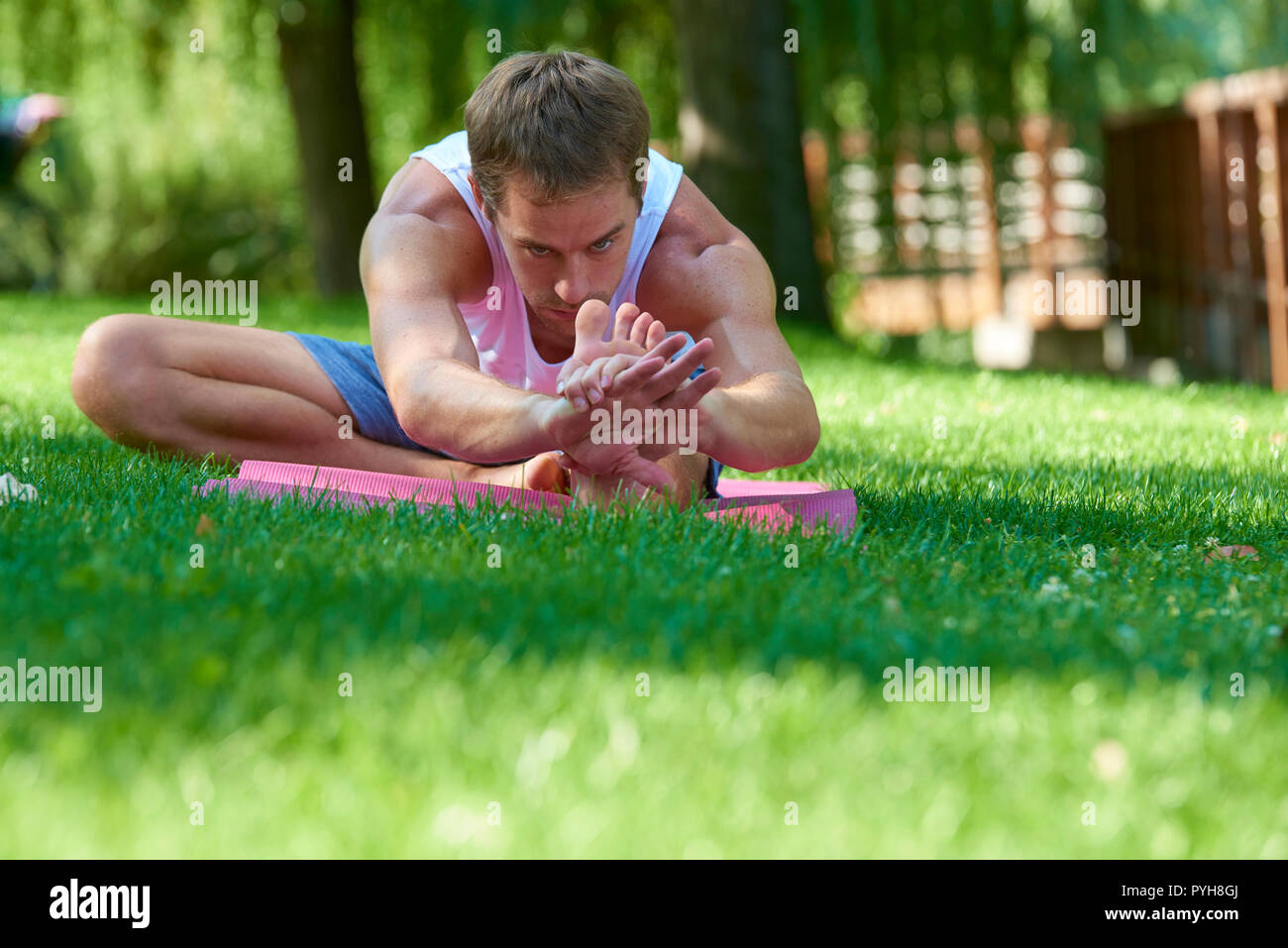 Full length shot of man doing yoga outdoor Stock Photo - Alamy