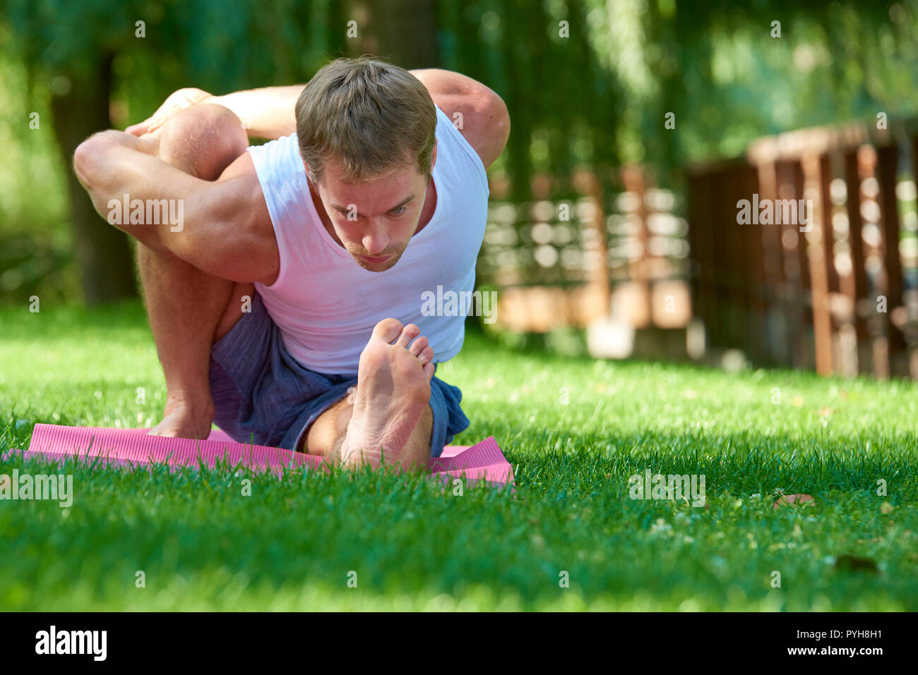 Full length shot of man doing yoga outdoor Stock Photo - Alamy