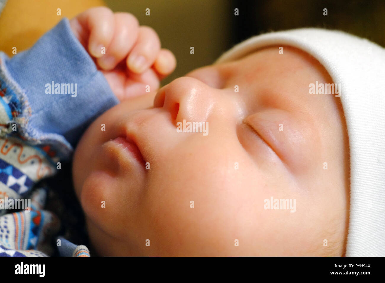 The child raised his hand to his face. Quietly dozing Stock Photo - Alamy