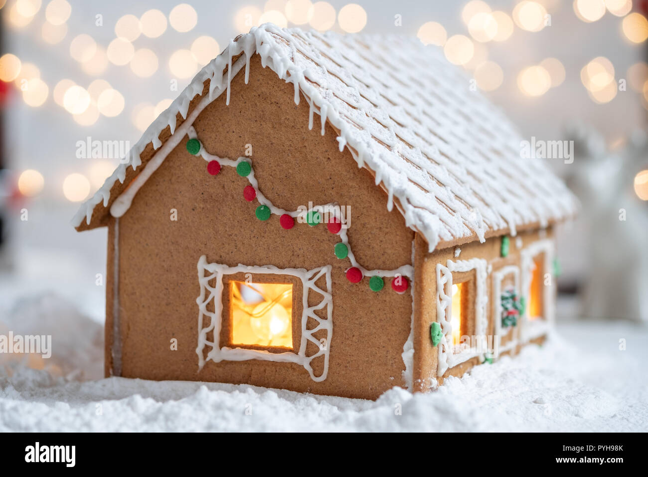Gingerbread house in snow Stock Photo - Alamy