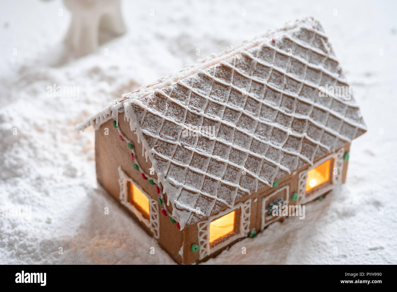 Gingerbread house in snow Stock Photo - Alamy