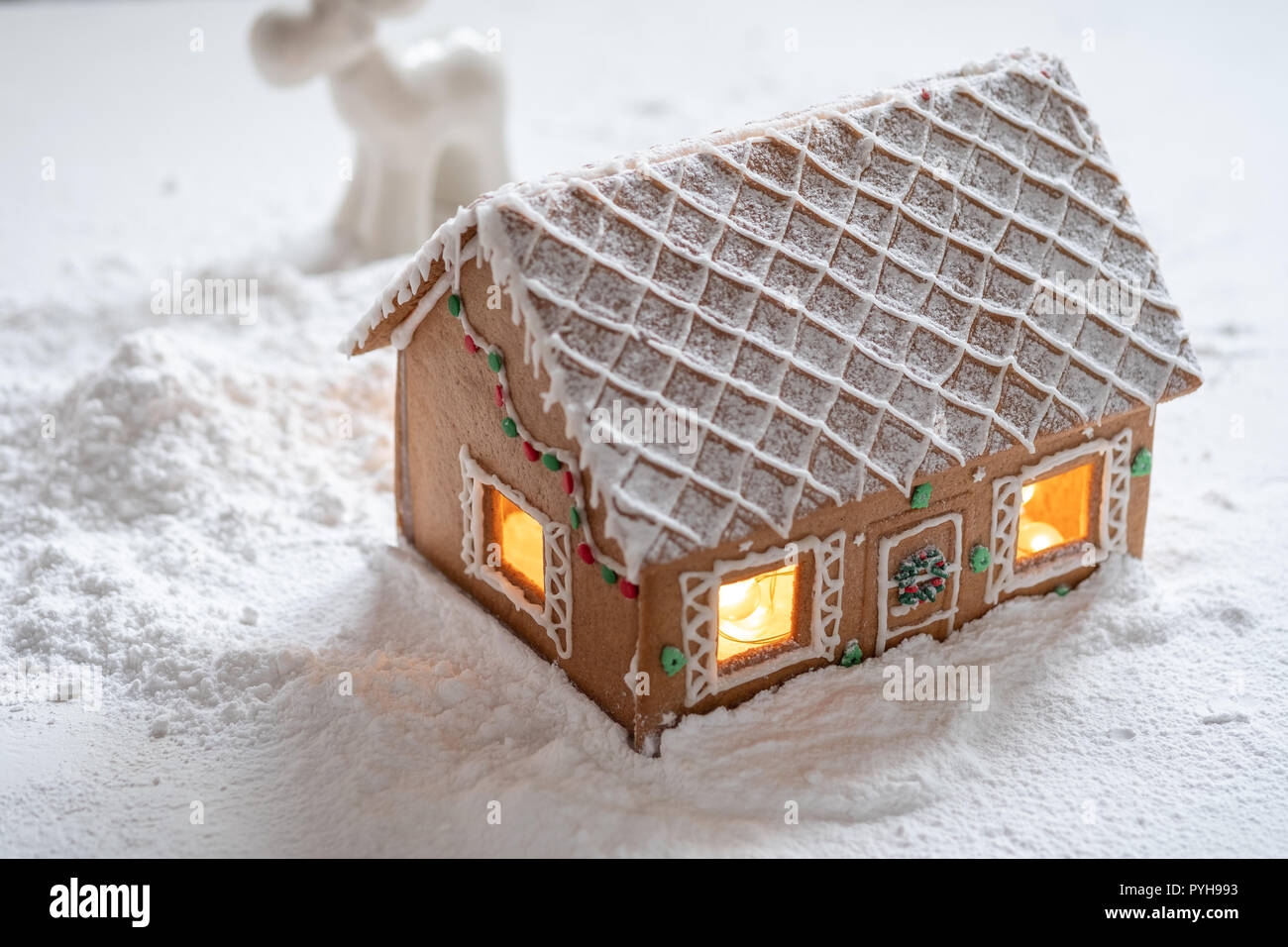 Gingerbread house in snow Stock Photo - Alamy