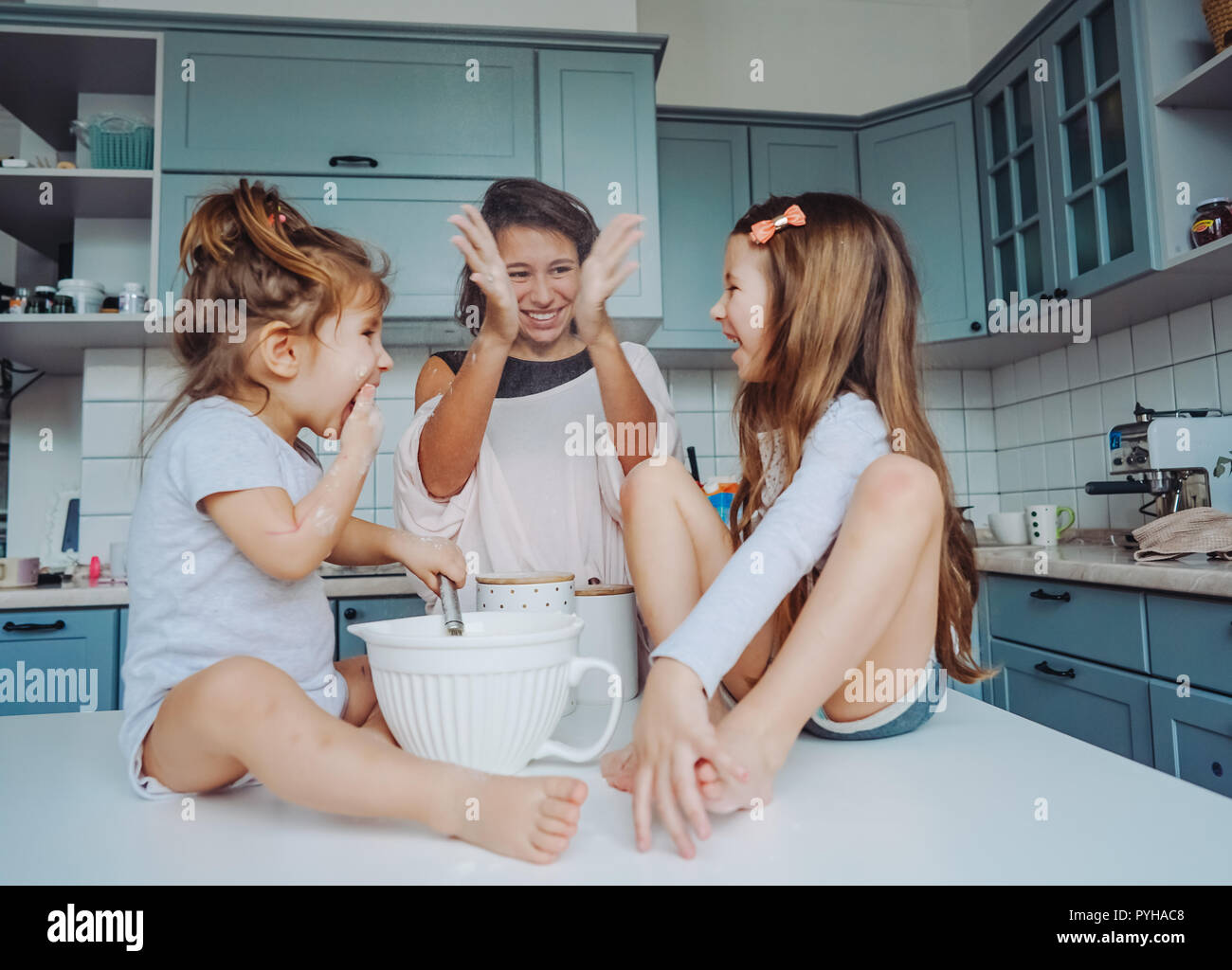 Happy family cook together in the kitchen Stock Photo - Alamy
