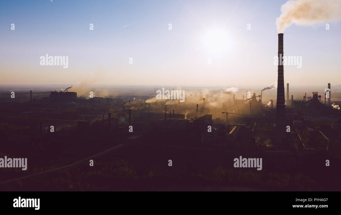 industrial landscape with heavy pollution produced by a large factory ...