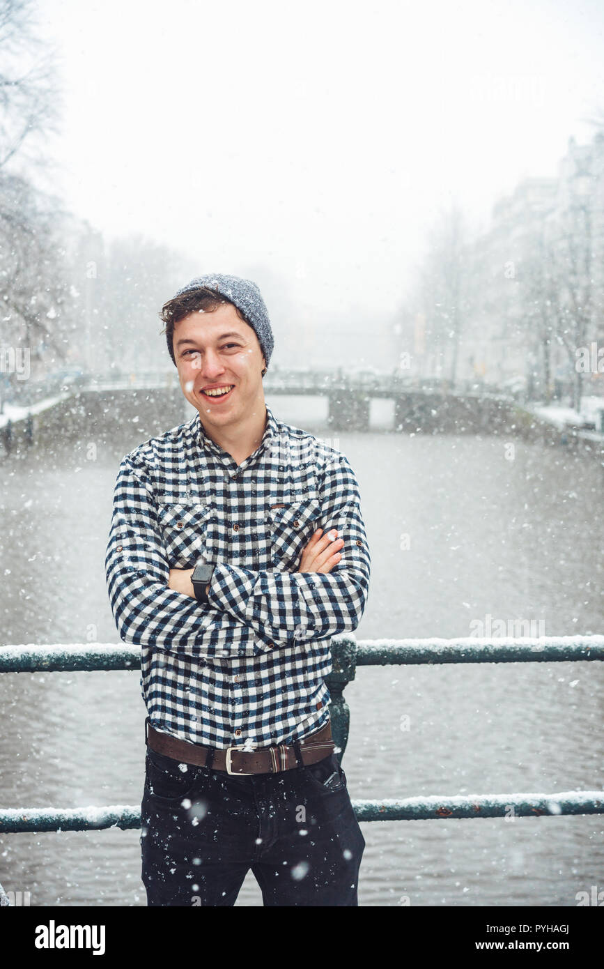 Guy is standing on a bridge Stock Photo - Alamy