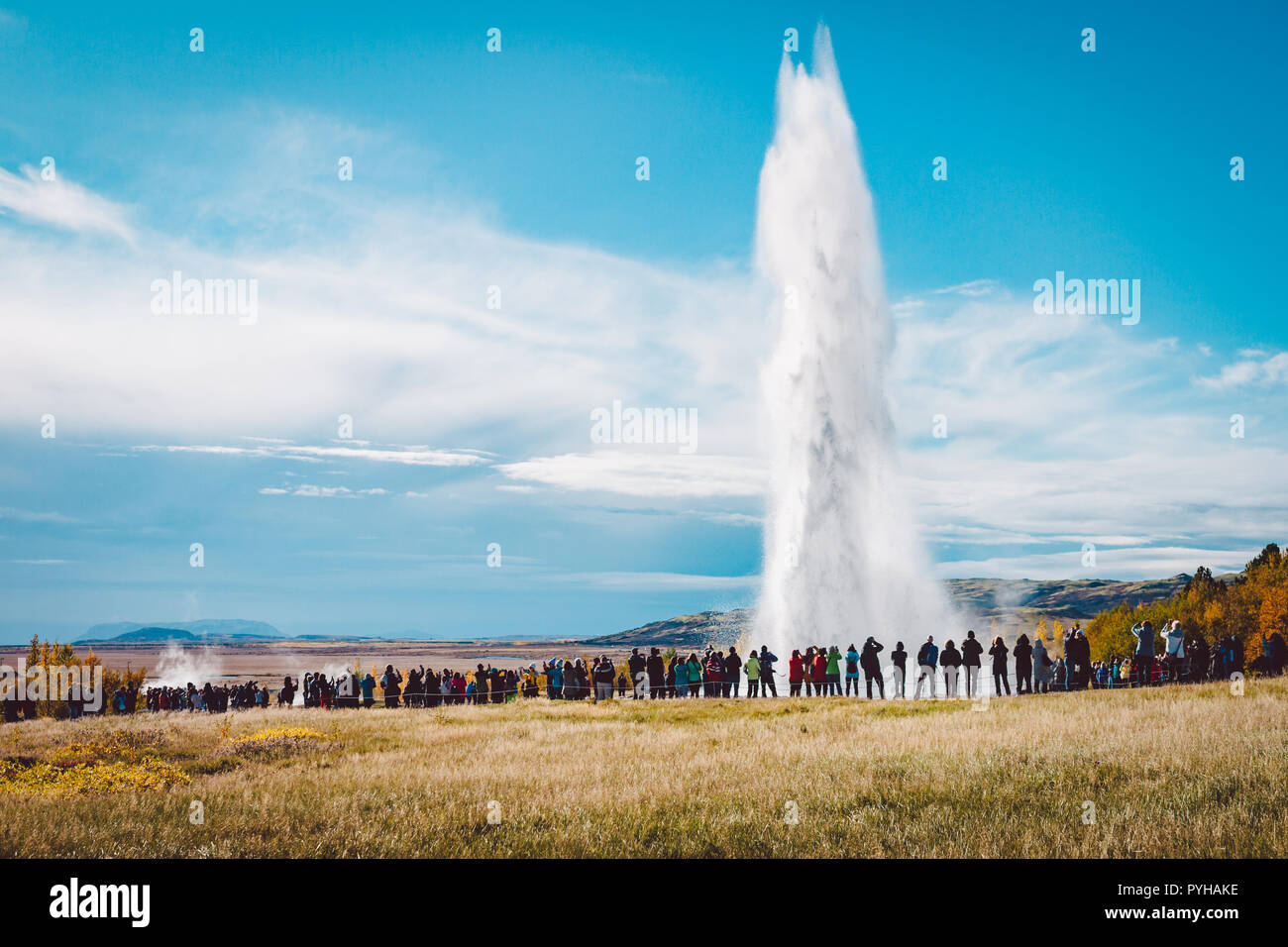 A crowd admiring an eruption of Stokkur geyser on Iceland Stock Photo ...