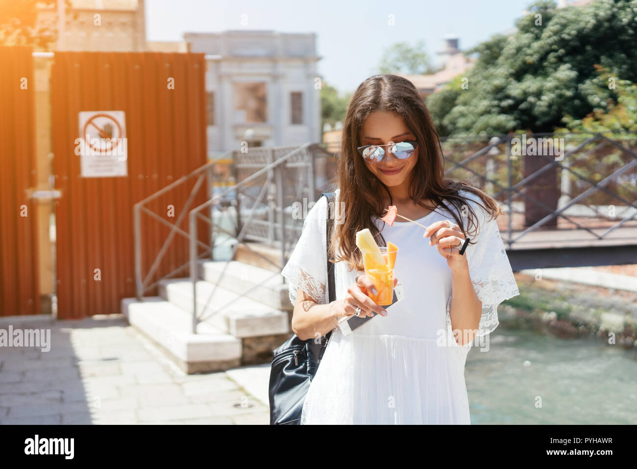 Beautiful young woman eating healthy food on travel vacation Stock ...