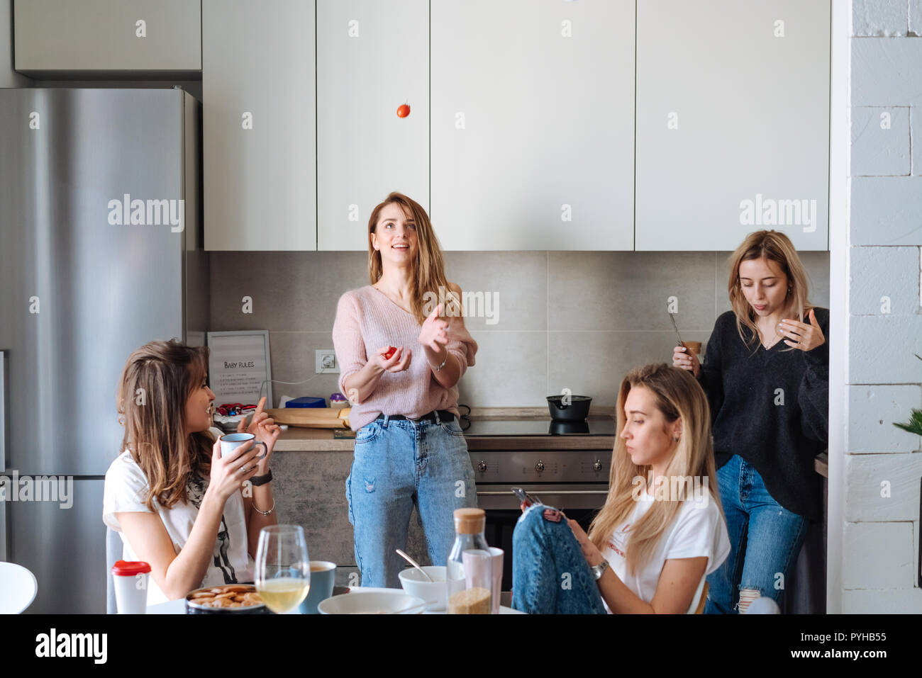 group of women in the kitchen Stock Photo - Alamy